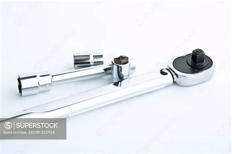 Torque wrench with dynamometric key on white background - SuperStock