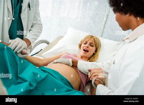 Woman Giving Birth At Hospital