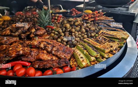 Large Round Rotating Grill With Assorted Meats And Vegetables Rotary Grill Demonstration Of