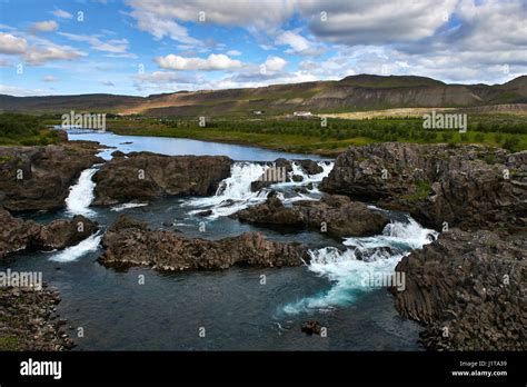 Glanni Waterfall Near Grabrokarhraun Lava Field And The Small Village