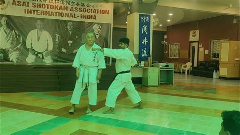 Kihon Kumite Step In Reverse Block Tenshin And Haito Uchi Or A Tateken Uchi Counter Technique