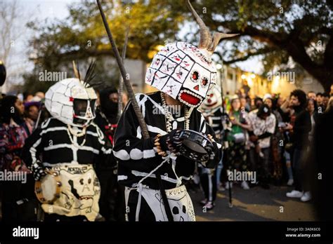 Members Of The Northside Skull And Bone Gang Carry Out A Procession Along Bayou Road In New