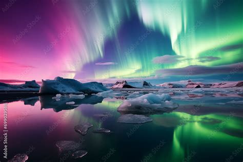 Colorful Northern Lights On Icelandic Glacier Lagoon With Icebergs