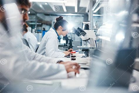 Medical Research And Scientist In Laboratory With Microscope