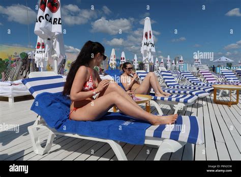 Young Women Sun Bathing At The Pool Of City Beach Club Located On A