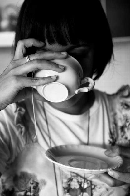 Premium Photo Close Up Portrait Of A Girl Drinking Coffee