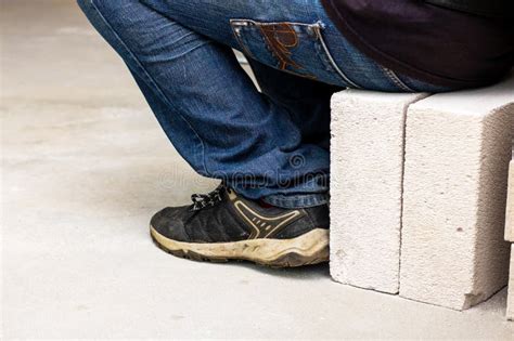 A Person Is Wearing Stylish Adidas Shoes While Crouched Down Stock Image Image Of Comfortable