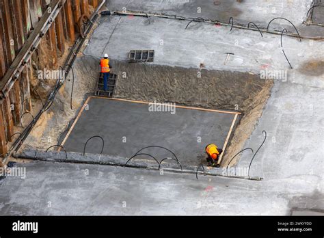 Construction Workers Pouring Concrete Foundation Hi Res Stock