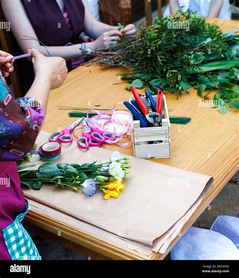 Beautiful Girl Florist Conducts A Master Class On Her Art In The Serbian National Village Stock