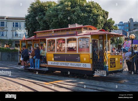 San Francisco Powell And Hyde Cable Car With Passengers Boarding Stock
