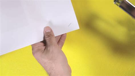 A Silver Metallic Stapler Fastens A Collection Of Printed Papers