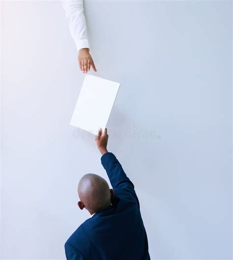 Rear View Business Man And Passing Document With Hand For Career Report Or Letter For Blank