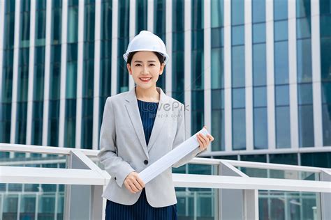 Female Construction Engineer Holding Drawings Image And Picture For