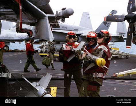 Crew Members Attached To Fighter Squadron Two One One Vf 211 Mount An