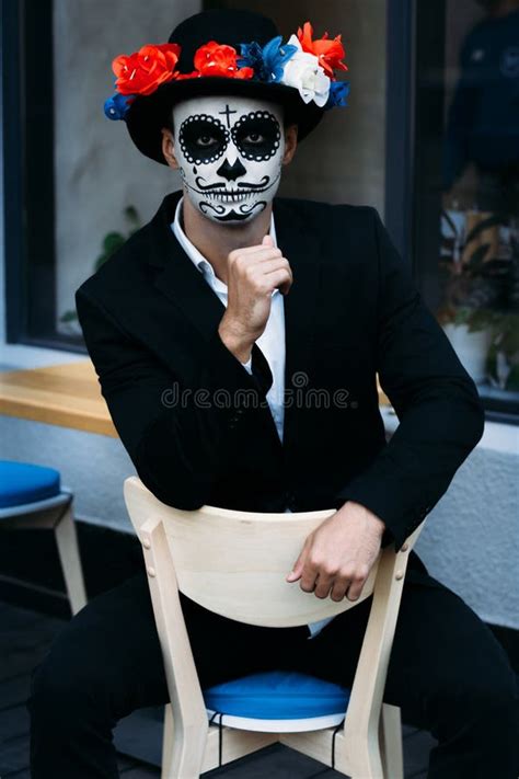 A Man With A Painted Face Of A Skeleton A Dead Zombie In The City