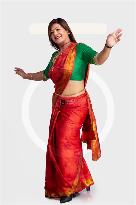 Authentic Nepali Woman Dancing In Red Saree And Gold Ornaments During