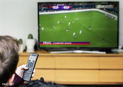Couple Watching A Football Game On Tv Premium Image By