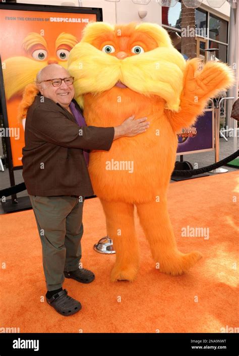 Actor Danny Devito And The Lorax Arrive At The Premiere Of The Animated