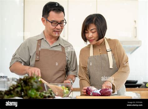 Lovely Adult Asian Husband And Wife Enjoy Cooking Making A Healthy