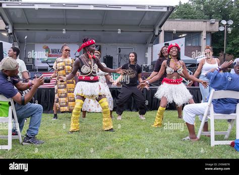 2 Dancers From The Fusha Dance Company Dance With Audience Members While Being Photographed At