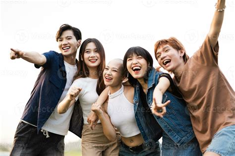 Image Of A Group Of Young Asian People Laughing Happily Together