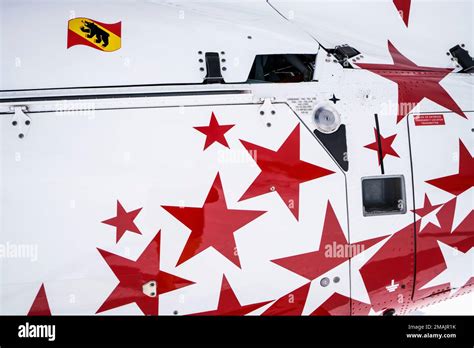 Swiss Helicopter Close Up Side View With Red And White Stars On Chassis Fuel Entrance Step