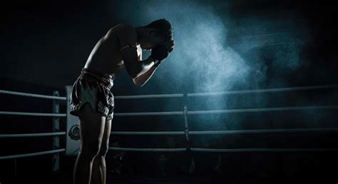 Male Athlete In Traditional Attire Performs Pre Fight Ritual Dark