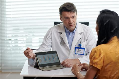 Premium Photo Plastic Surgeon Showing Patient Various Ways To Insert