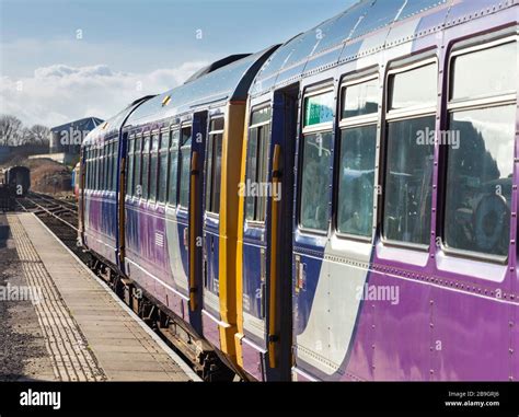 View Looking Down The Side Of Class 142 Pacer Trains 142060 142028
