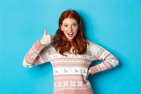 Redhead Girl Shows Support And Approval With Thumbs Up Photo Background