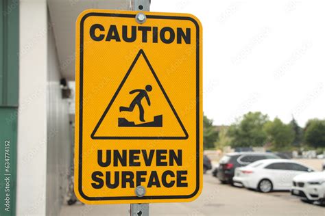 Caution Uneven Surface Sign With Caption And Illustration Picture Of