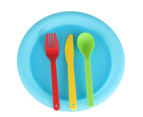 Premium Photo Bright Plastic Disposable Tableware Isolated On White