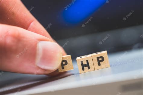 Premium Photo Php Programming Web Language Wooden Cubes With Letters Php Lying On A Laptop Concept