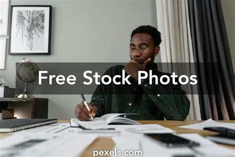 Man Thinking Glasses Green Shirt Notebook Photos Download The Best