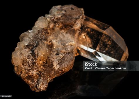 Small Rhinestone Crystal On Substrate On Black Background With