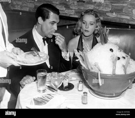 Cary Grant And His Latest Flame Phyllis Brooks Share A Meal At Cafe