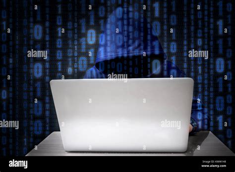 hacker using keyboard typing bad data into computer online system and