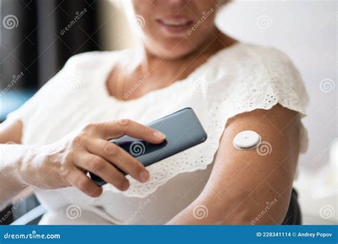 Woman Testing Glucose Level With Continuous Glucose Monitor Stock Photo Image Of Analysis