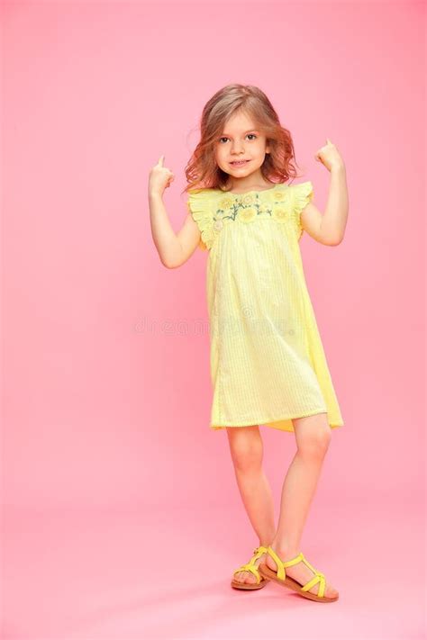Young Cute Girl In Yellow Dress Stock Image Image Of Expression Pink