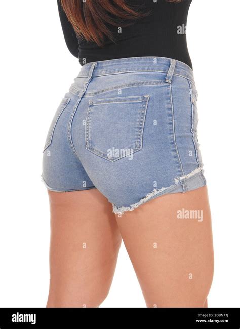 A Young Beautiful Woman Standing From The Back In In Jeans Shorts