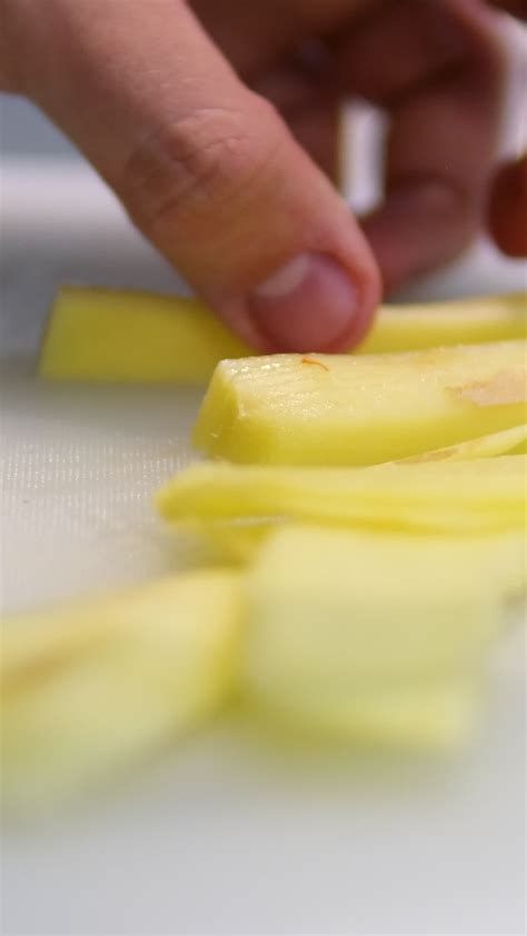 Chop Ginger Sliced Ginger Root Falls On A Wooden Surface Slow Motion