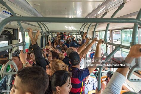 People Riding A Crowded Public Bus The Public Transport Is Most Busy