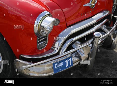 Vintage Red 1956 Oldsmobile Futura With A Polished Chrome Bumper Grill