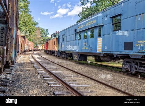 A Colorful Row Of Old Train Cars And Retired Cabooses In Tilton New