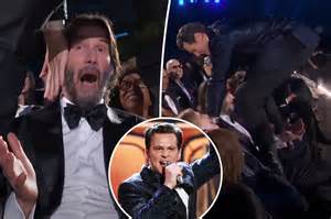See Keanu Reeves Hilarious Reaction To Being Straddled By Jonathan Groff At 2025 Tony Awards