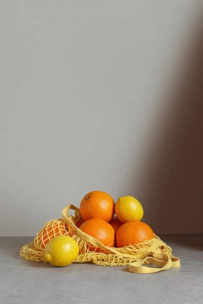 Premium Photo Zero Waste Packaging Oranges And Lemons In A String Bag