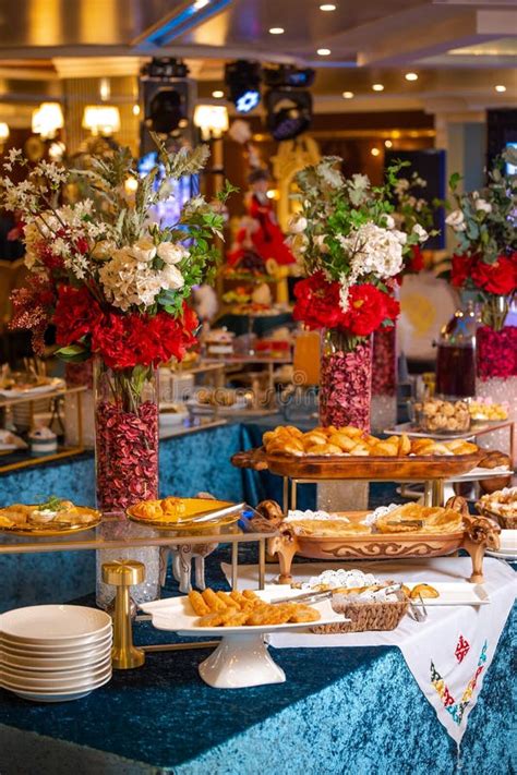 Delicious Buffet Spread With Pastries Bread And Floral Centerpieces Stock Image Image Of