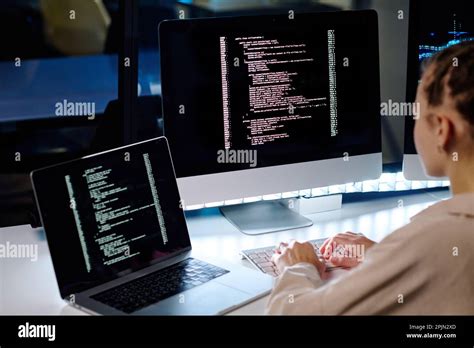 Focus On Computer Screen With Coded Data While It Engineer Sitting By