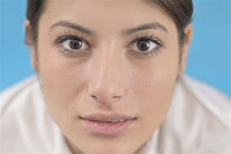Confident Young Woman Looking Directly At Camera With Intense Gaze