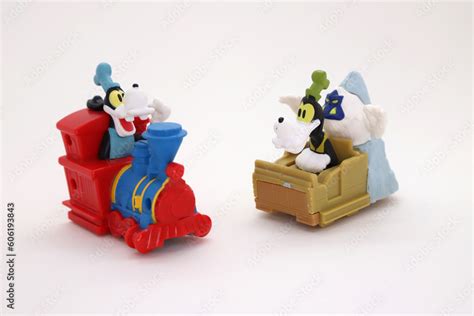 Two Toy Versions Of The Animated Character Goofy At Walt Disneys Amusement Park Goofy On A